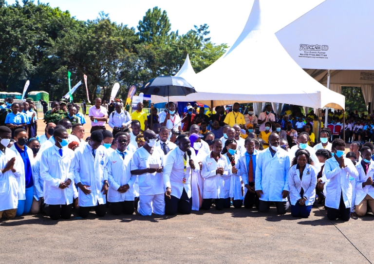 Ugandan doctors kneel and ask Museveni, 78, to stand for seventh term ...