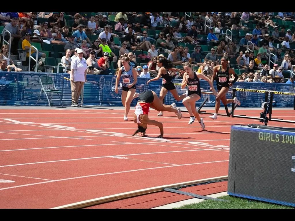 Viral moment high school athlete somersaults over finish line to win ...